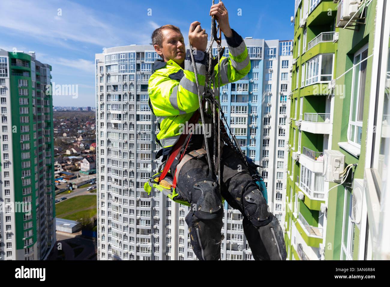 Professional Window Cleaner Performing Safe and Efficient Maintenance ...