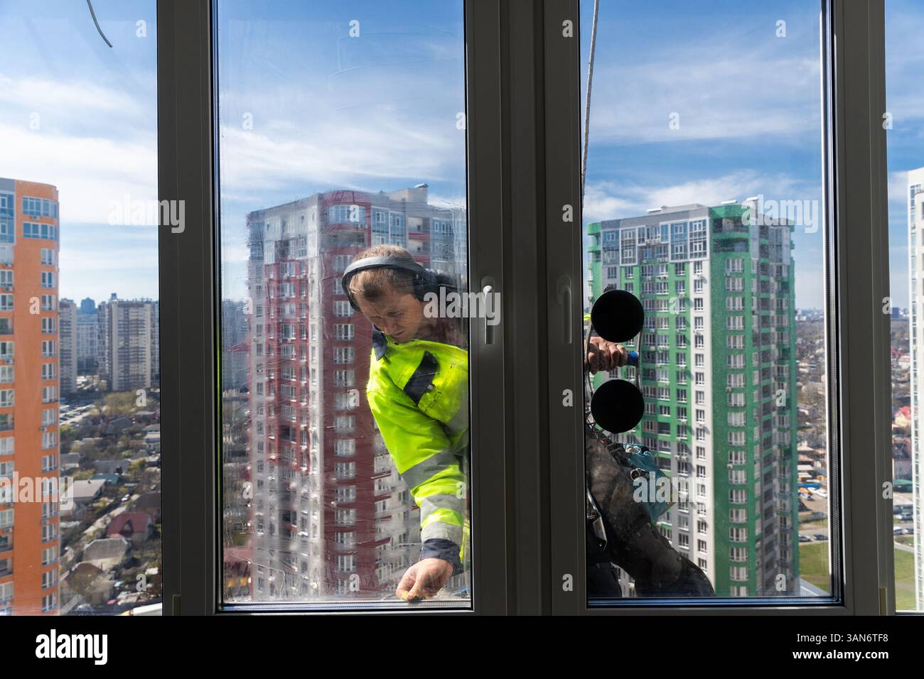 High-Rise Window Cleaner at Work: A Daring View from the City Skyline ...