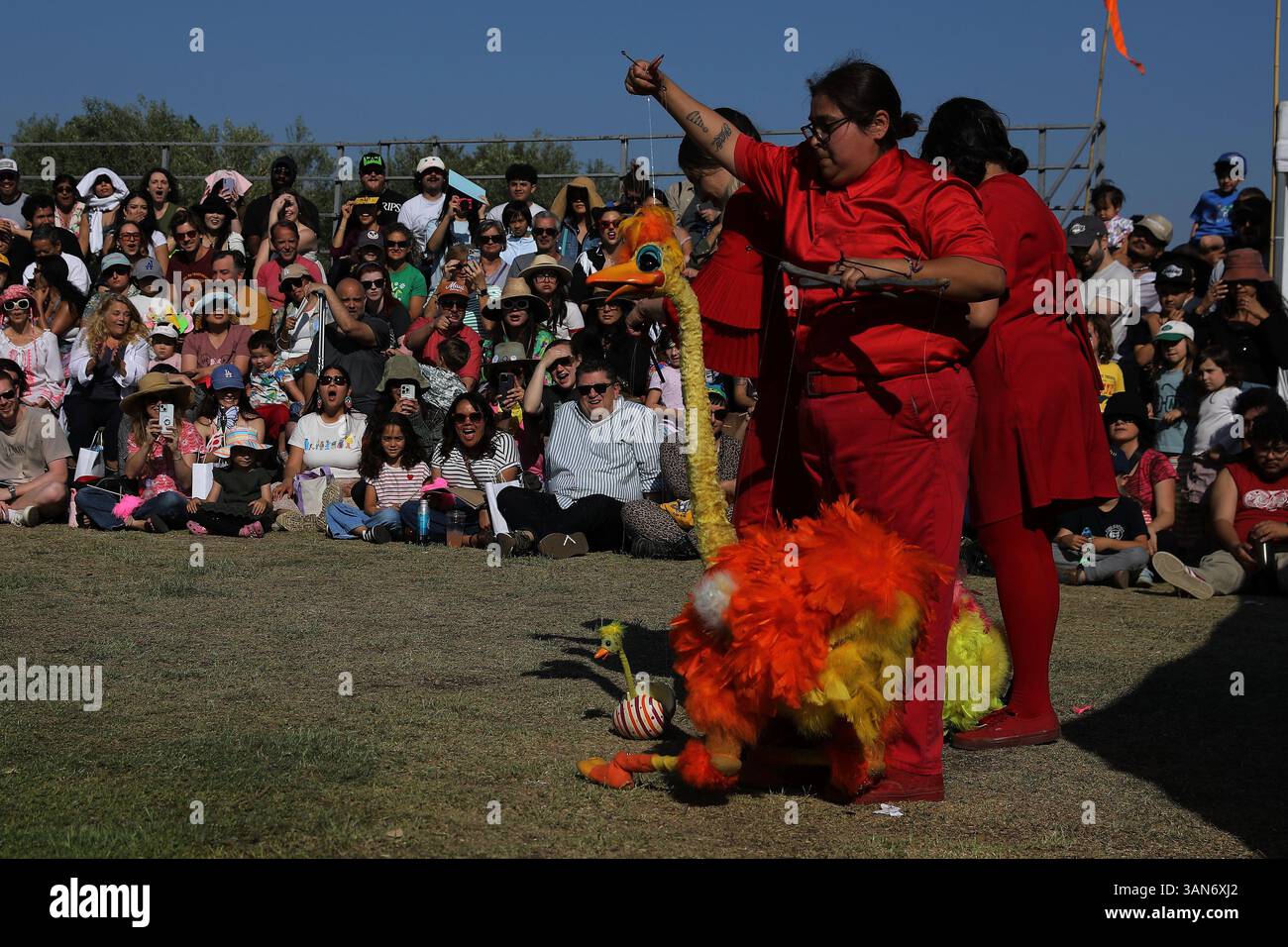 Los Angeles, USA. 13th Apr, 2025. People watch a puppet show during the ...
