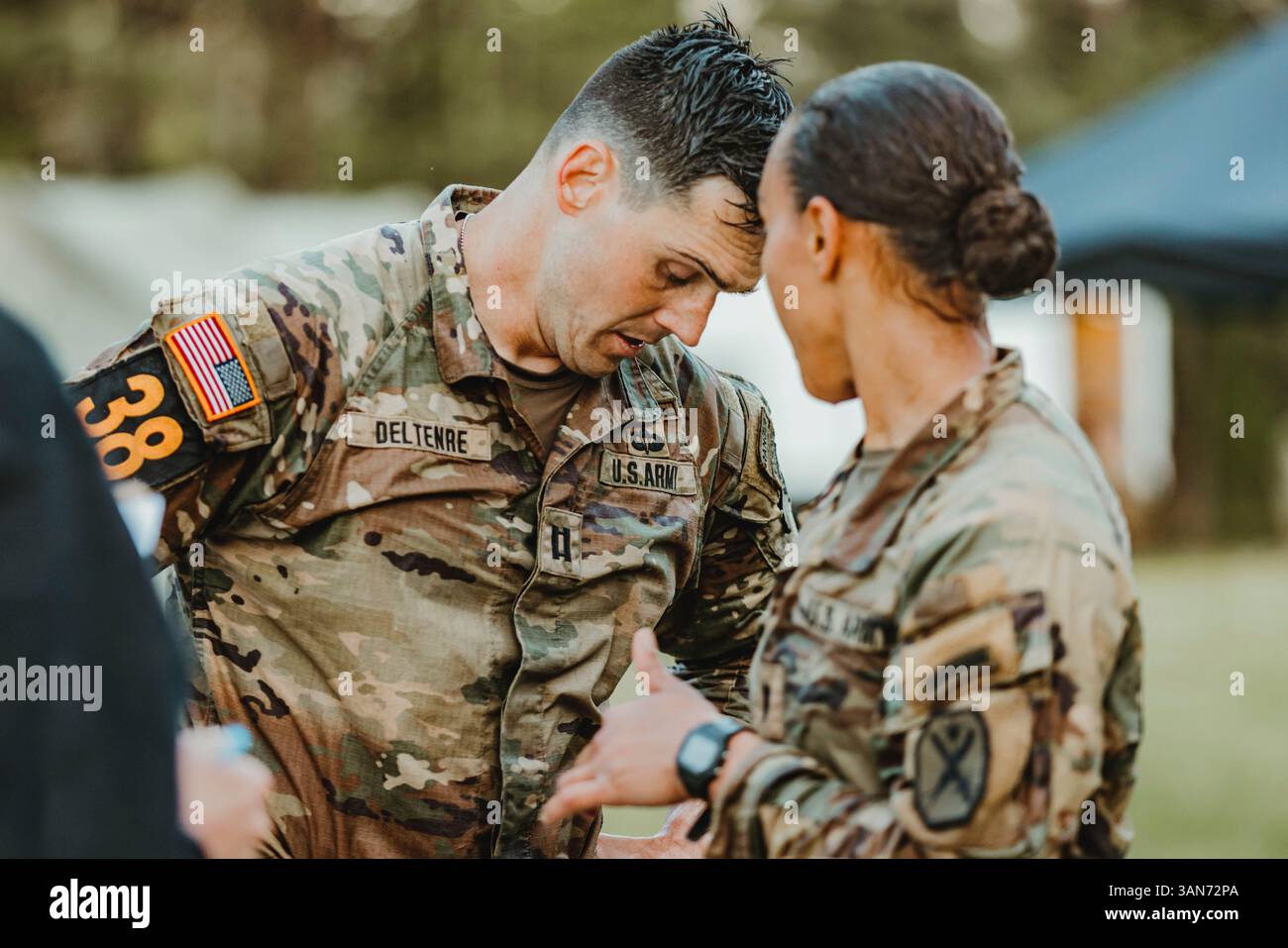 This image provided by the U.S. Army shows Capt. Seth Deltenre, left ...
