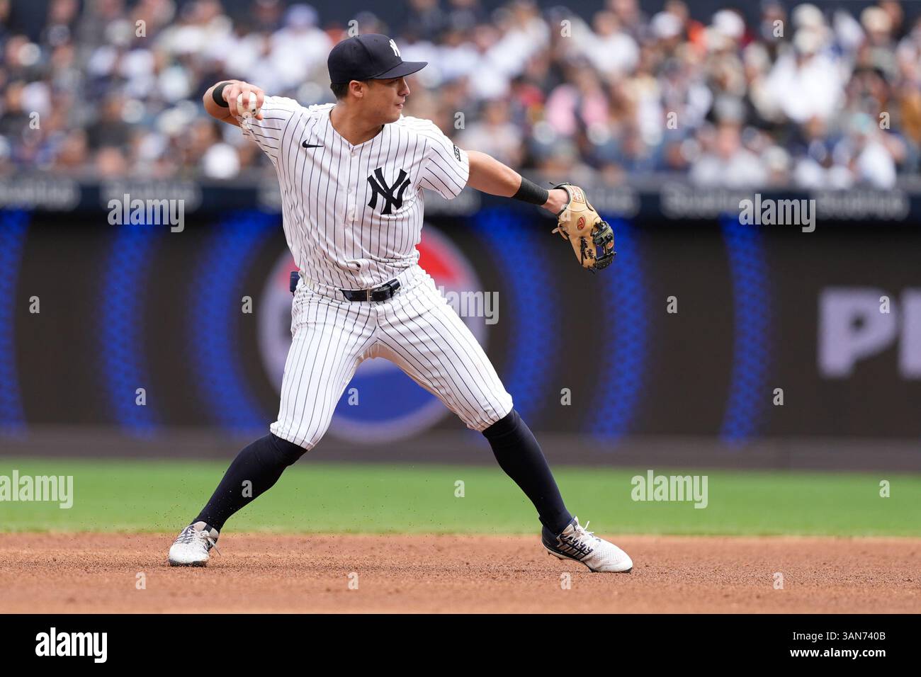 BRONX, NY - APRIL 13: New York Yankees Shortstop Anthony Volpe (11) throws out San Francisco ...