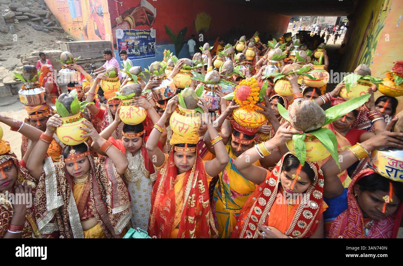 PATNA, INDIA - APRIL 14: Devotees carry holy Kalash on the bank of ...