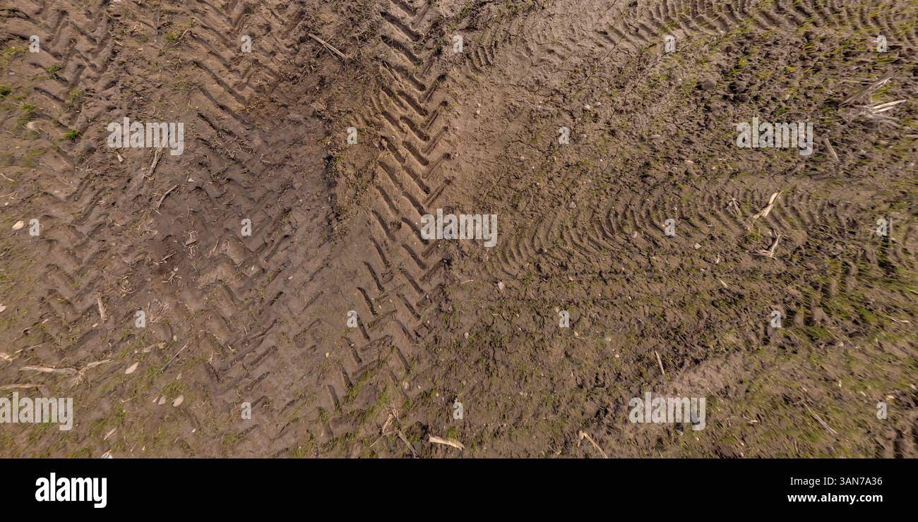 view from above on surface of texture of dry road with tractor tire ...