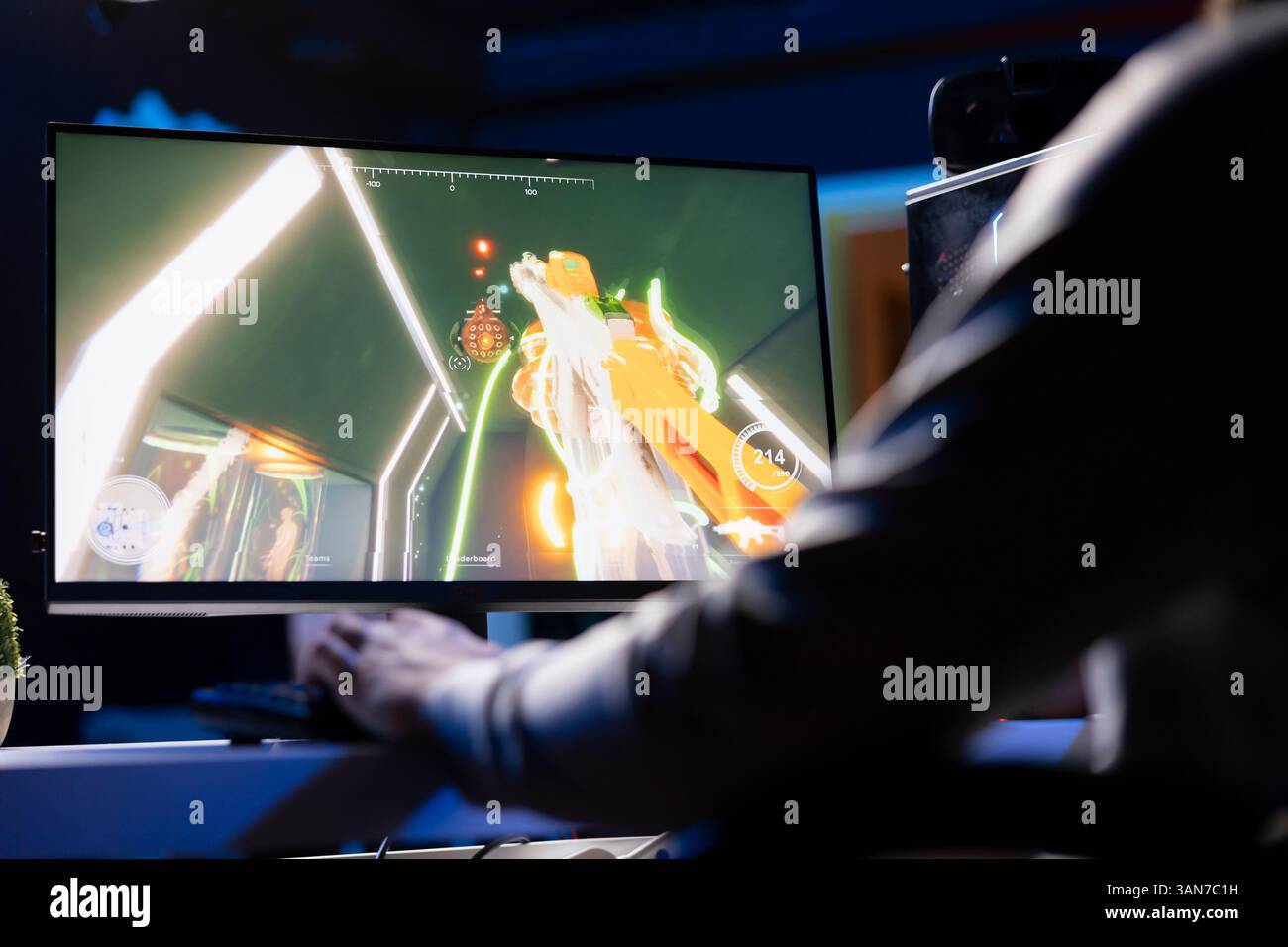 Man playing SF FPS videogame, having fun in dark apartment room, using ...