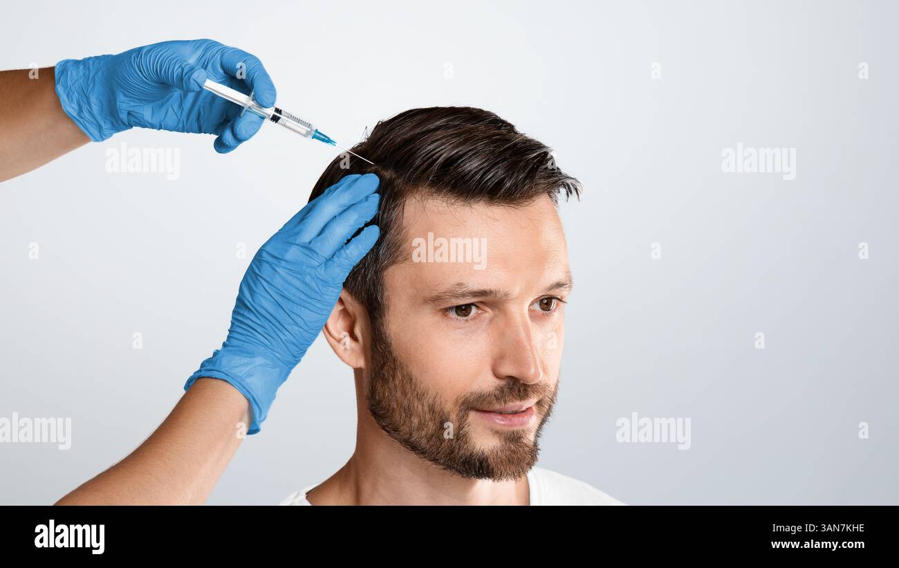 Mesotherapy for hair. Man receiving injections in head Stock Photo - Alamy