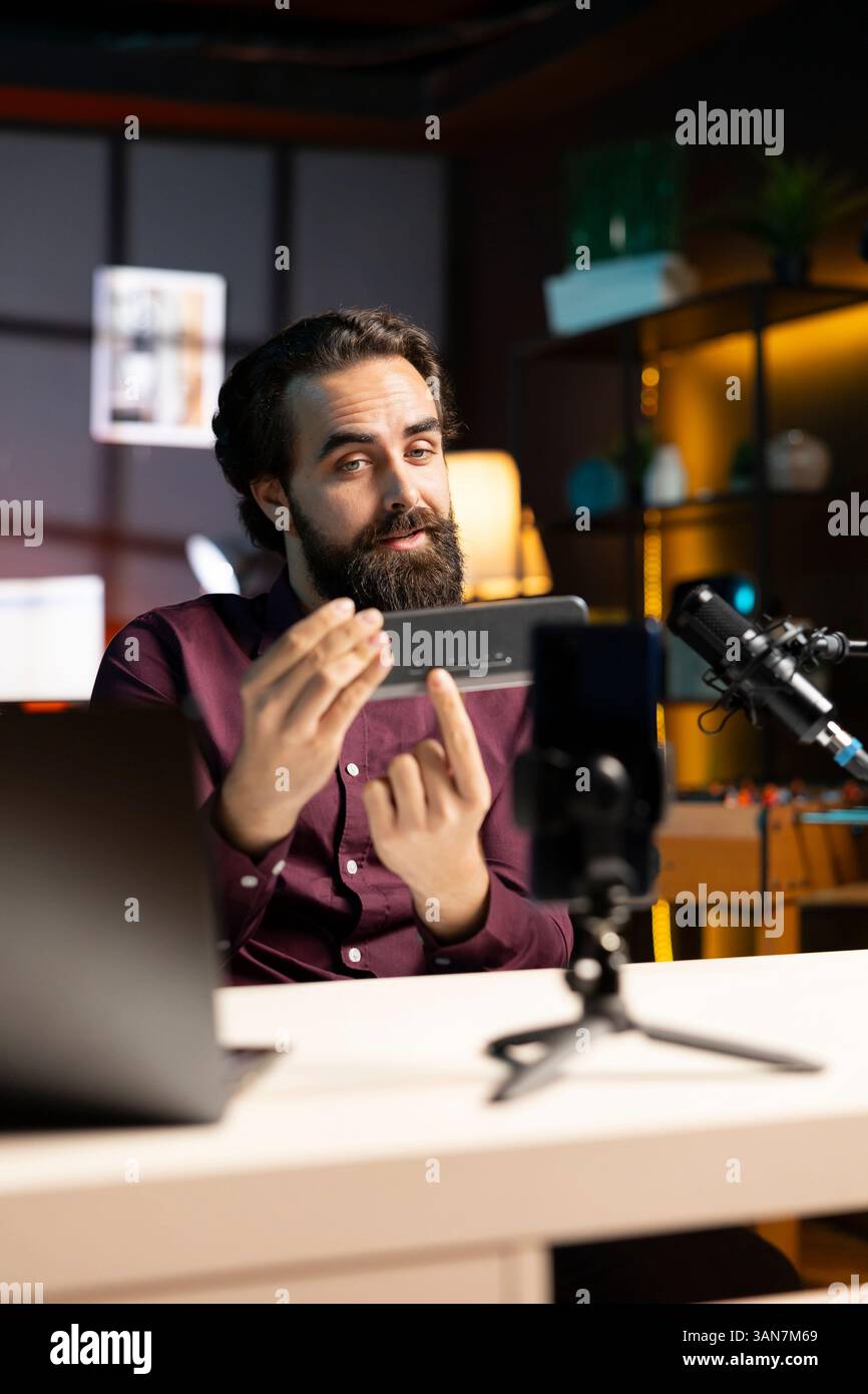 Tech guru informing audience about newly released mini soundbar. Man in ...