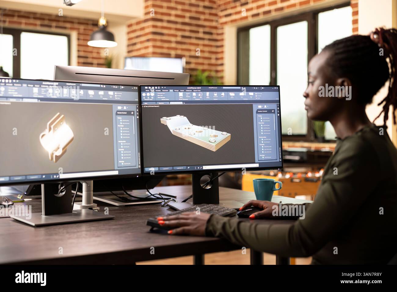 African american technical expert prototyping machinery and constructing engine models digitally ...