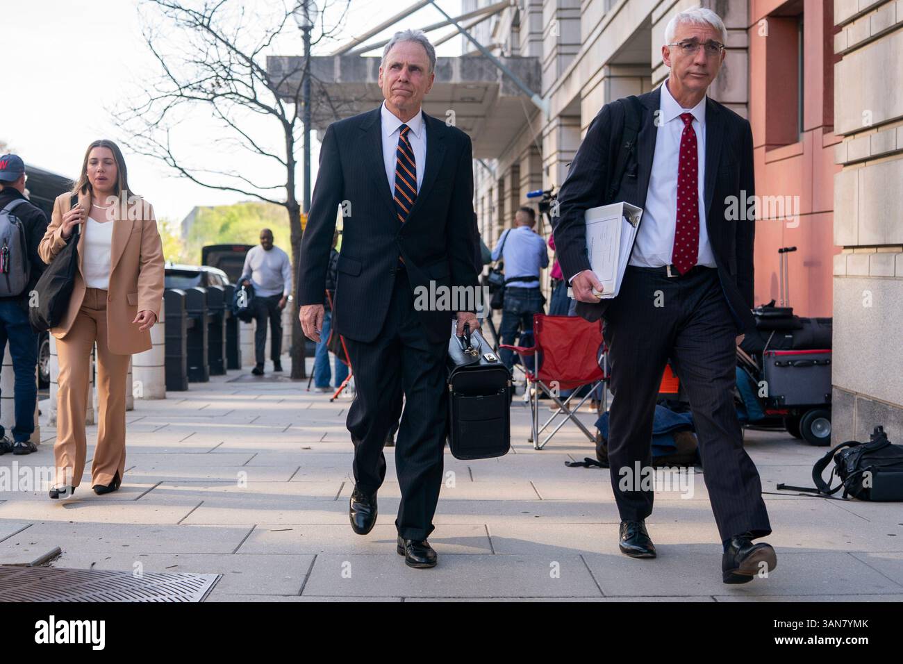 Mark Hansen, center, a lawyer for Meta, departs following the first day ...