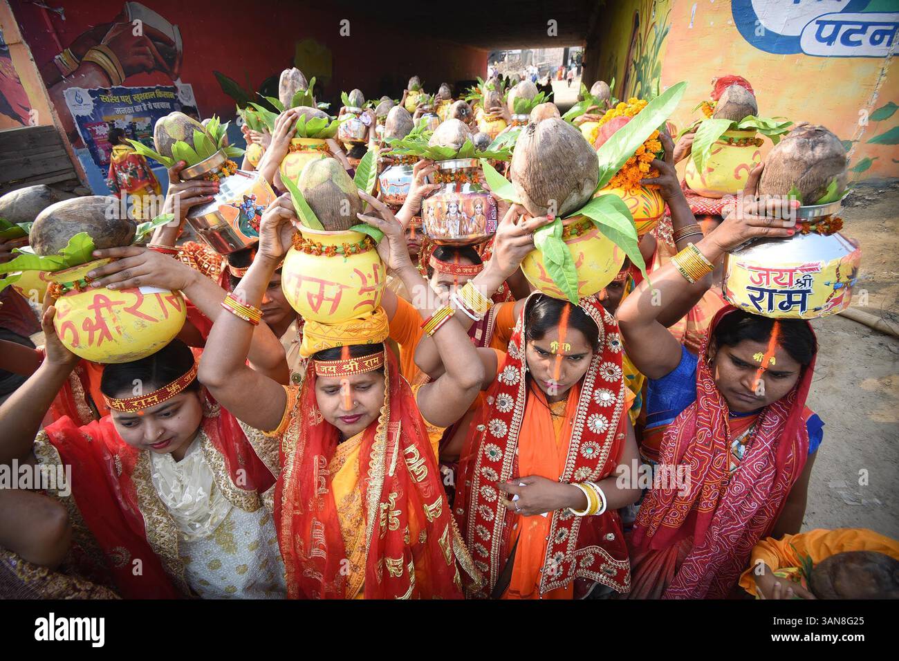 PATNA, INDIA - APRIL 14: Devotees carry holy Kalash on the bank of ...