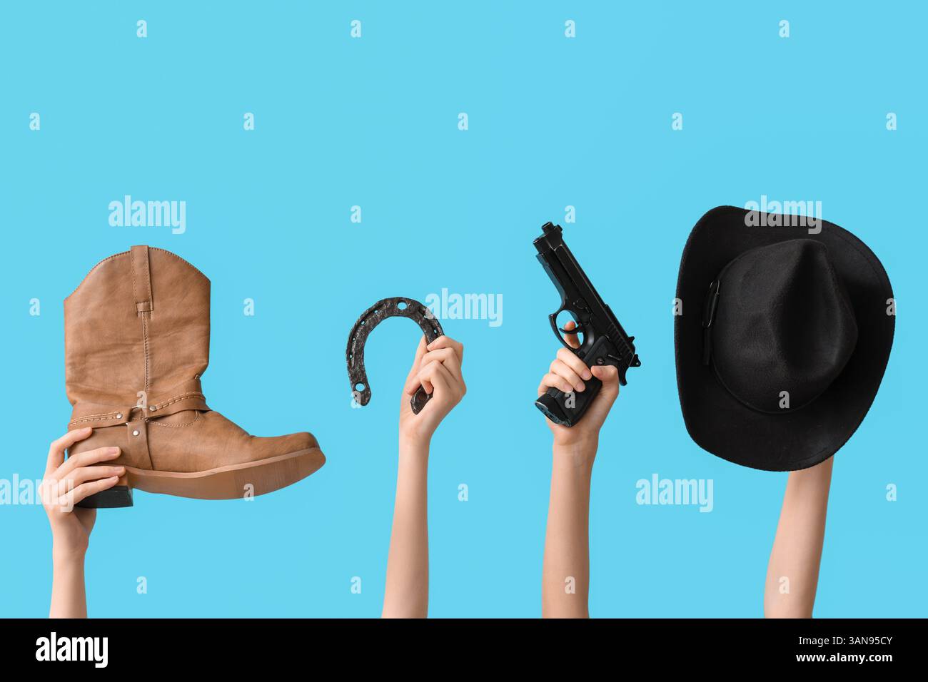 Female hands with cowboy accessories and gun on color background Stock ...