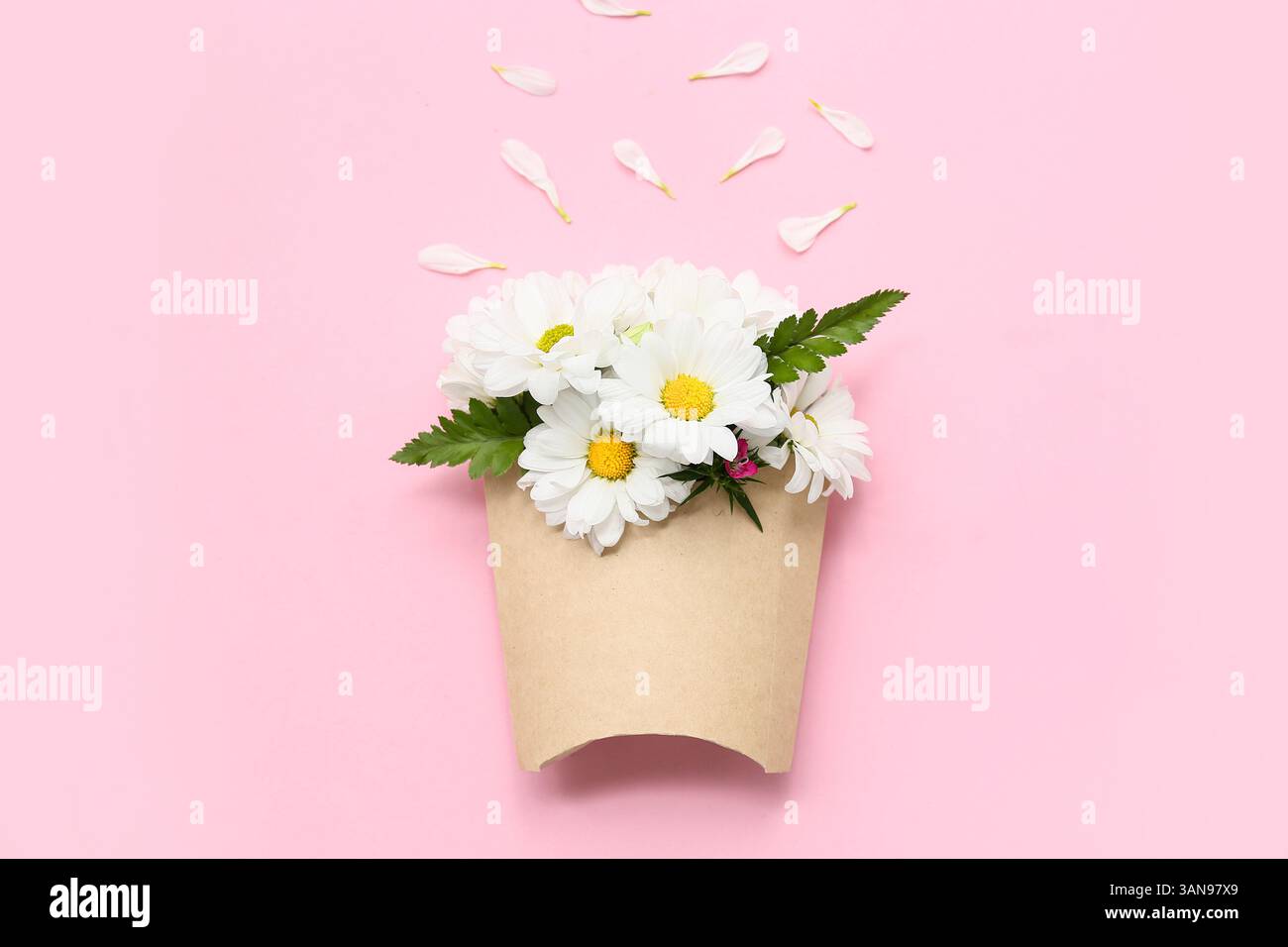 French fries paper box with beautiful flowers on pink background Stock ...