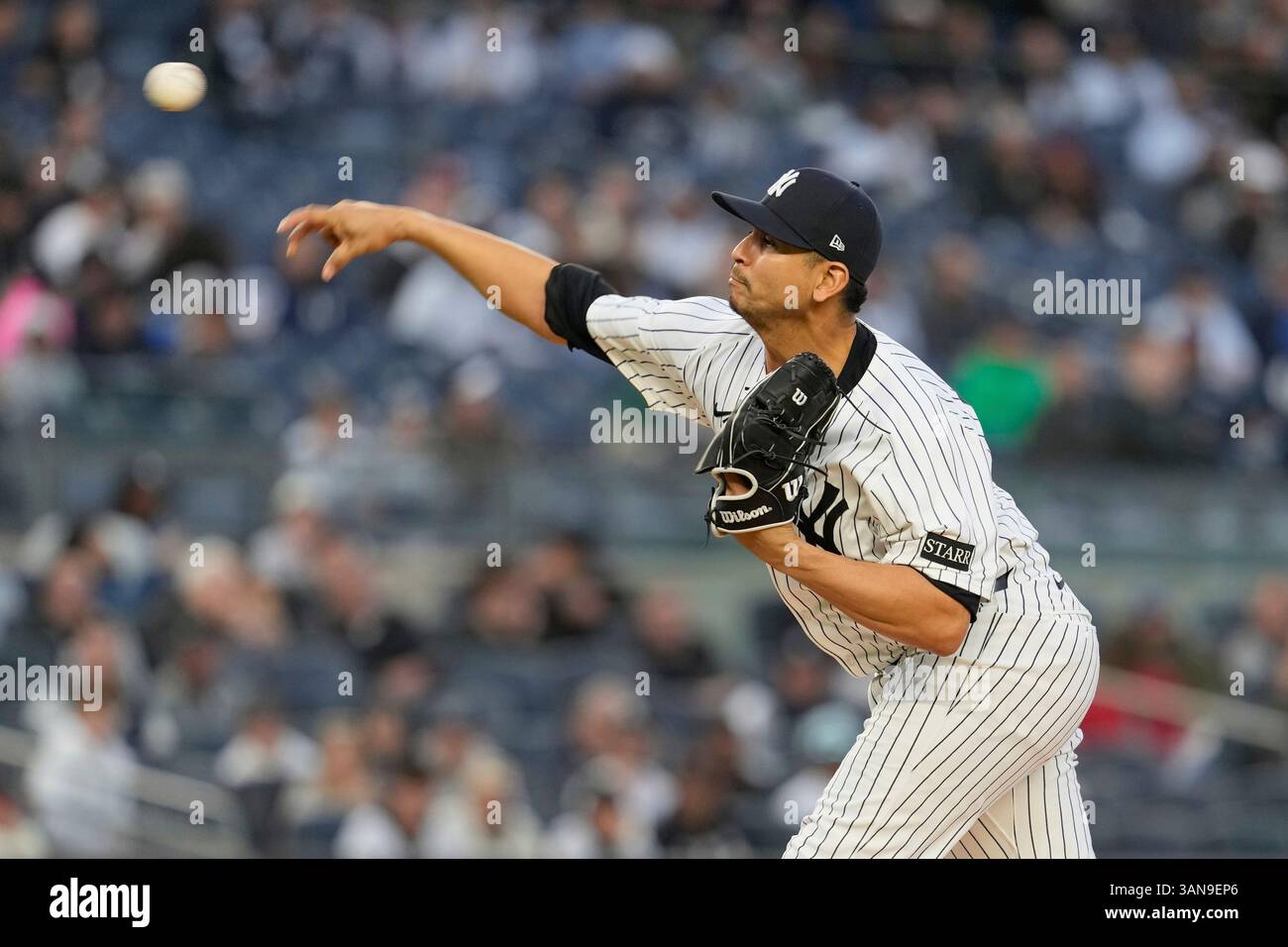 New York Yankees' pitcher Carlos Carrasco throws during the first ...