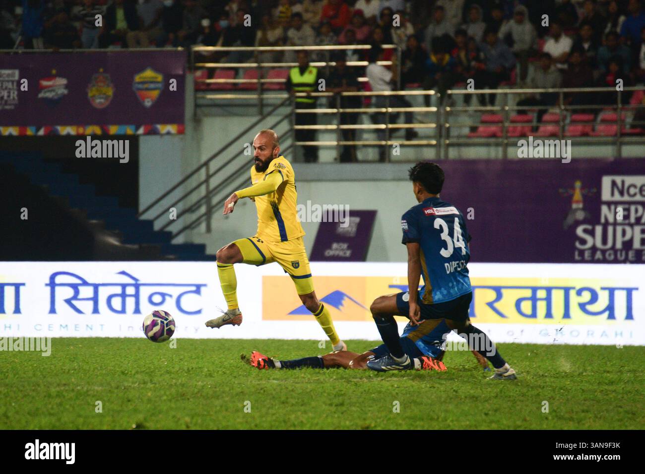 Kathmandu, Bagmati, Nepal. 14th Apr, 2025. HIJAZI of DHANGADHI FC runs ...