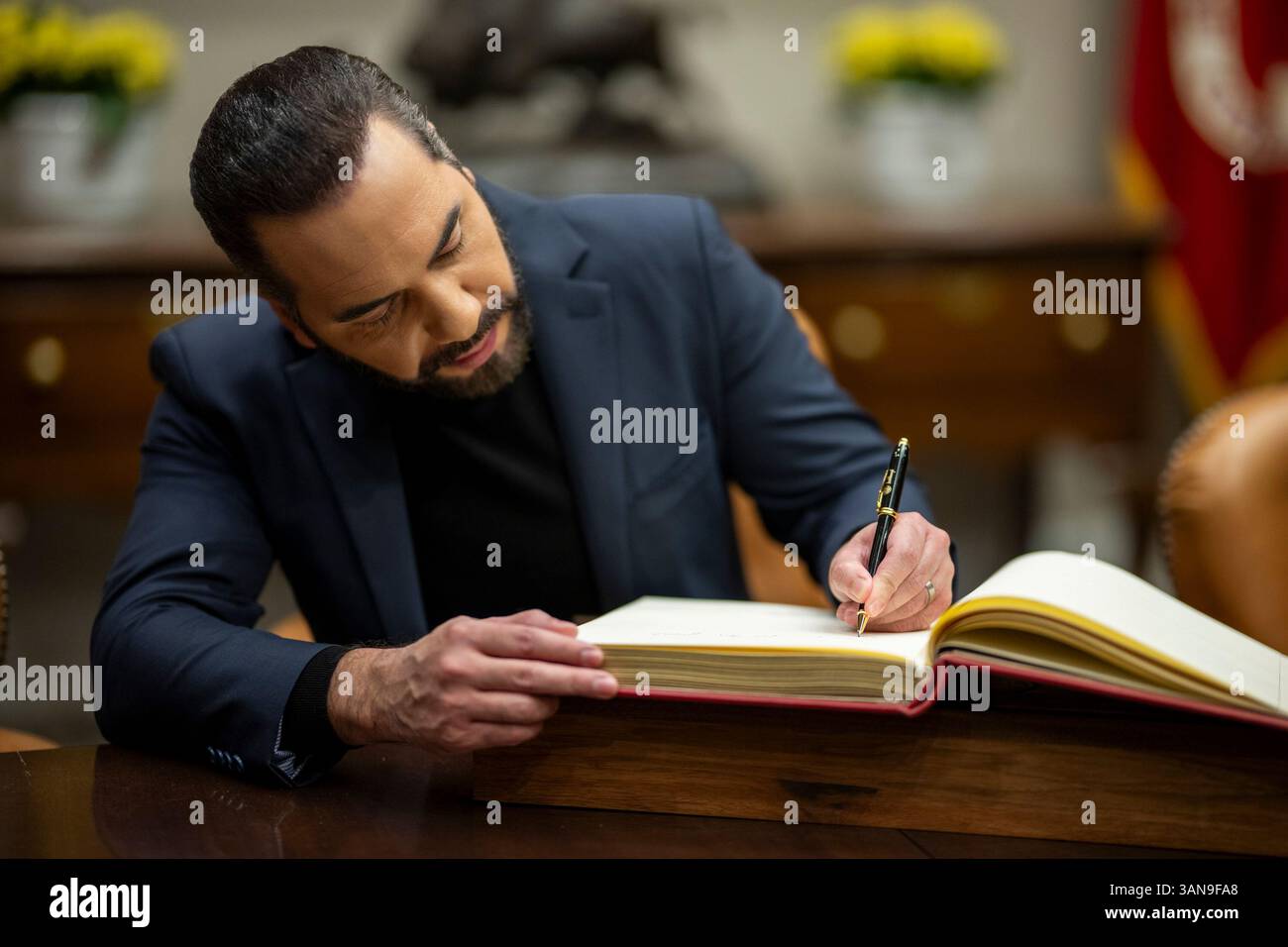 President Nayib Bukele of El Salvador signs the guest book in the ...