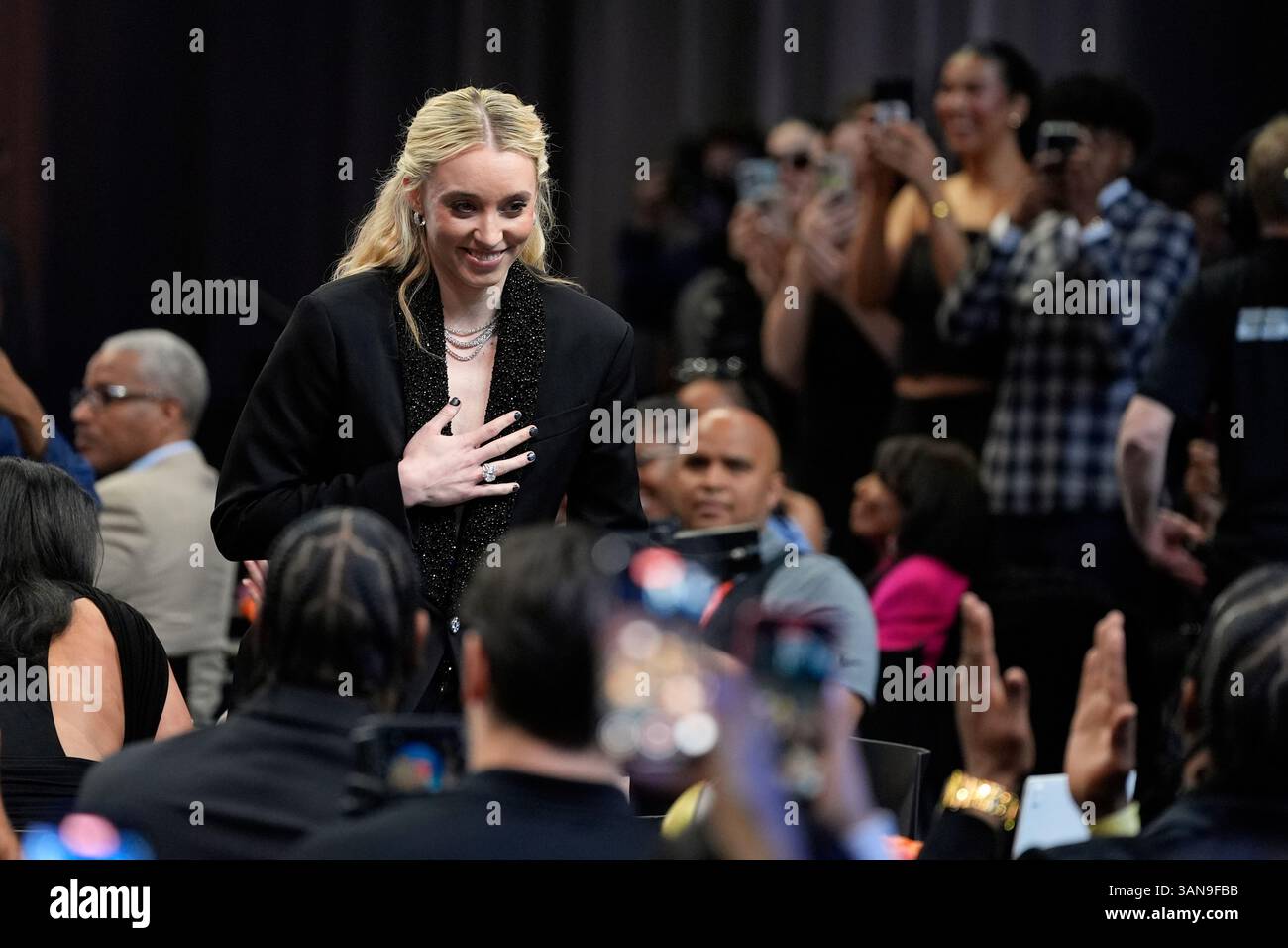 UConn's Paige Bueckers reacts after being selected first overall by the ...