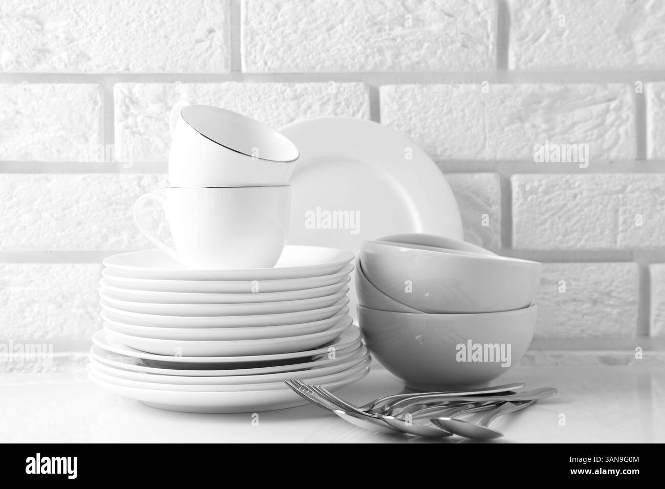 Clean cups on table Black and White Stock Photos & Images - Alamy