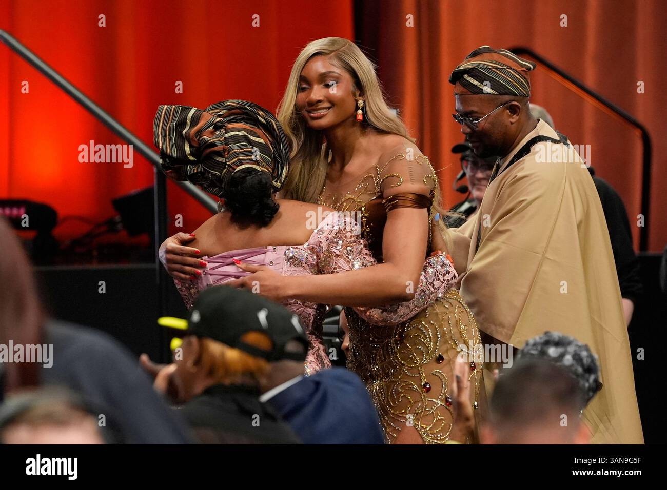 Southern California's Kiki Iriafen, center, celebrates after being ...