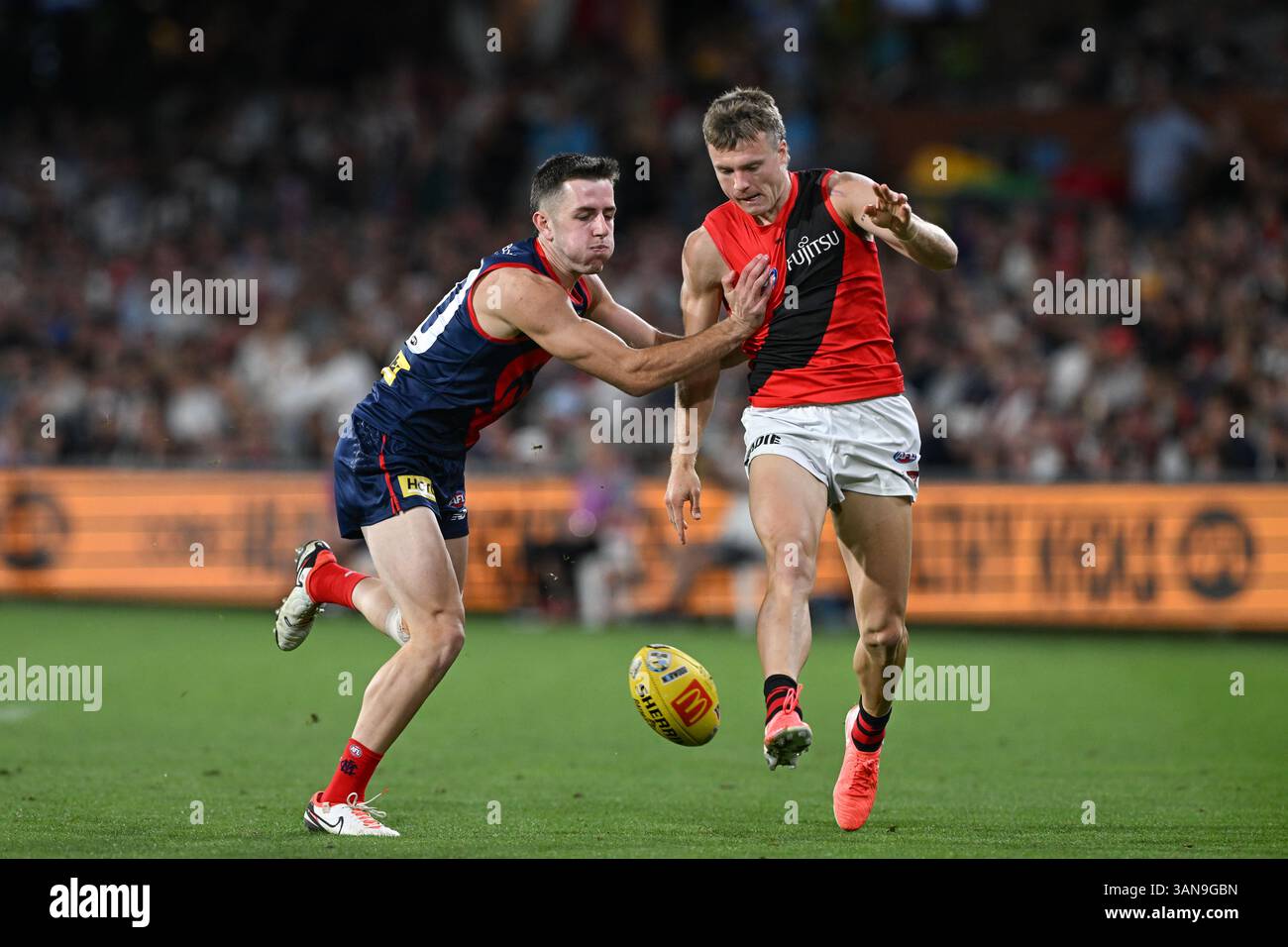 Adelaide, Australia. 12th Apr, 2025. Jye Menzie of Essendon kicks under ...