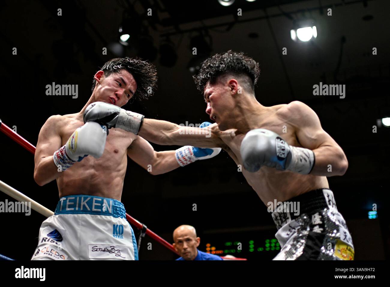 Tokyo, Japan. 8th Apr, 2025. Champion Toshiki Kawamitsu (silver gloves) throws a right at ...