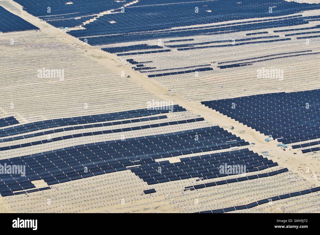 YINCHUAN, CHINA - APRIL 12, 2025 - Workers install solar photovoltaic ...