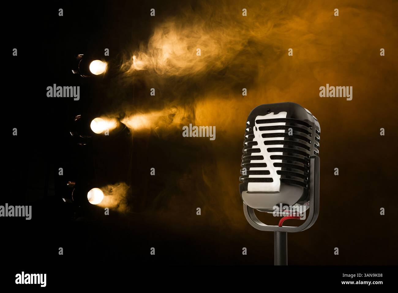 Vintage microphone on stage in smoke under spotlights. Singer's ...