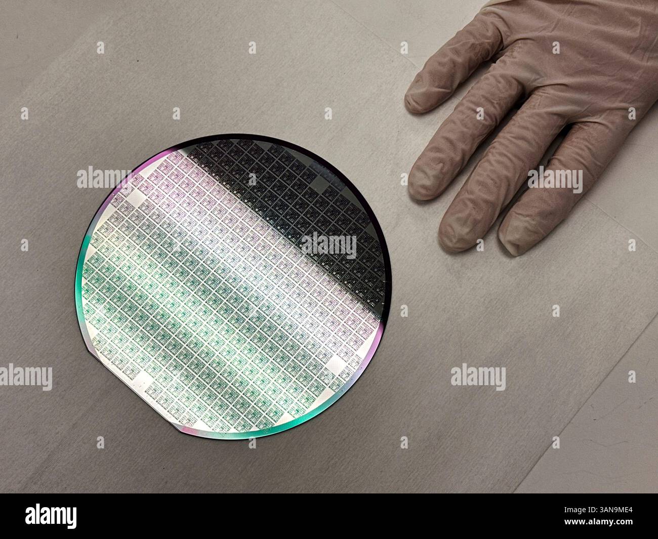 A semiconductor silicon wafer fabricated with several microchip ...