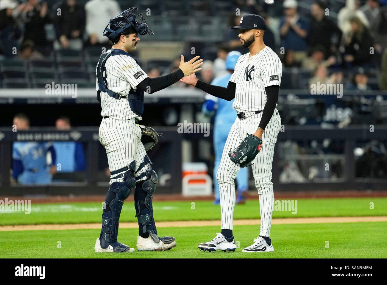 New York Yankees catcher Austin Wells, left, and pitcher Devin Williams ...