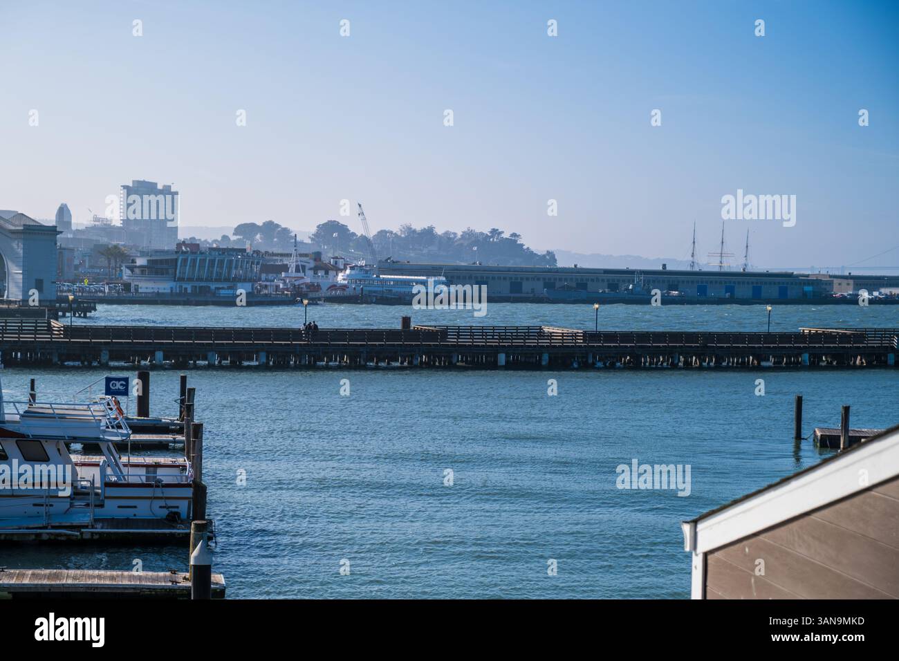 Waterfront at Pier 39 showing boats, water activities, and city skyline ...