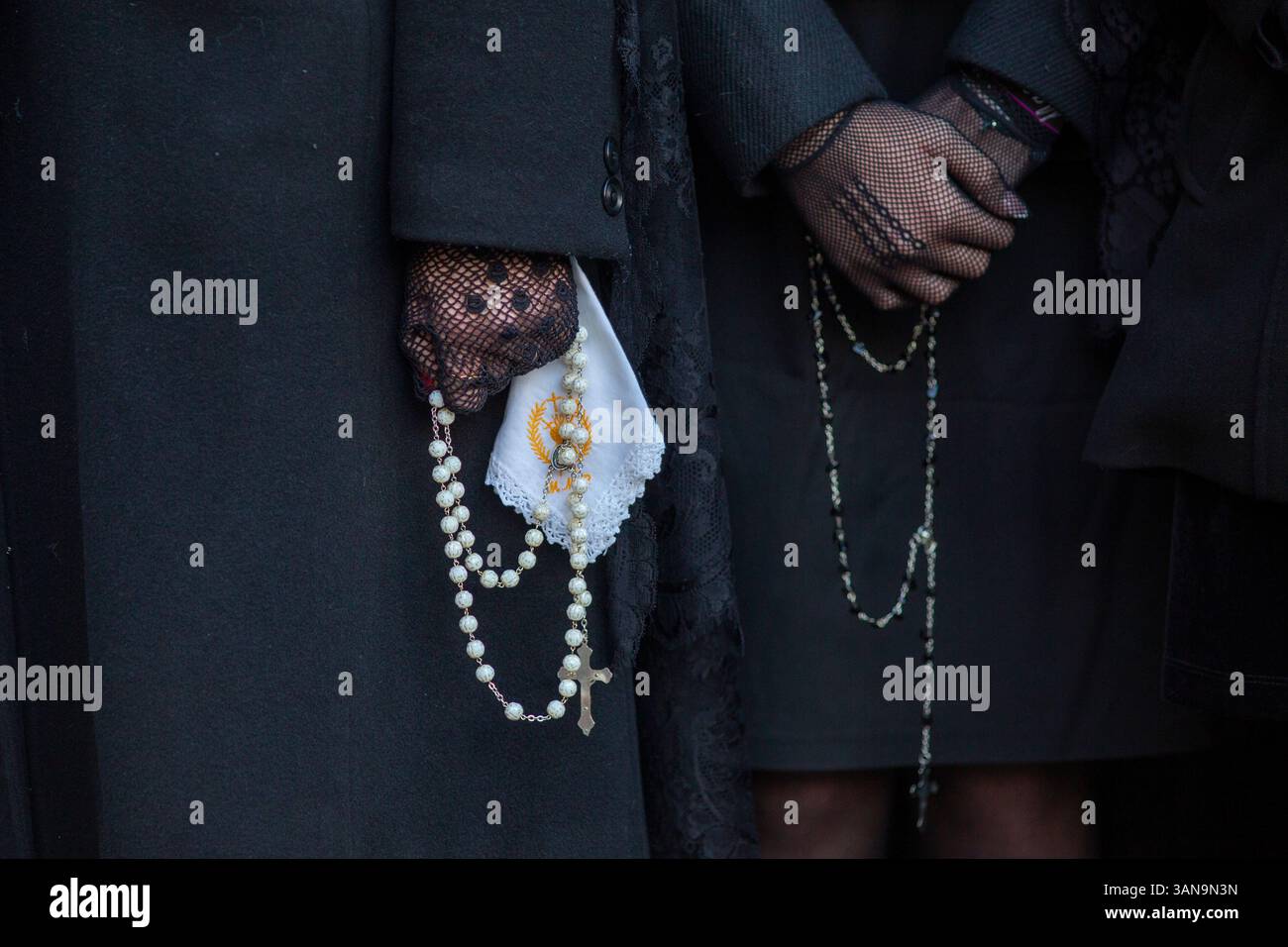 Women from the Our Lady of Sorrows Confraternity carry rosaries in ...