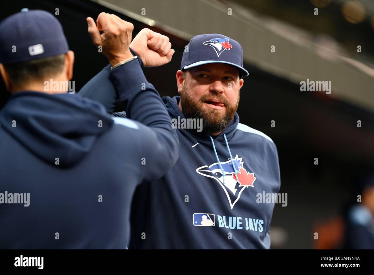 Toronto Blue Jays manager John Schneider, right, looks on before a ...