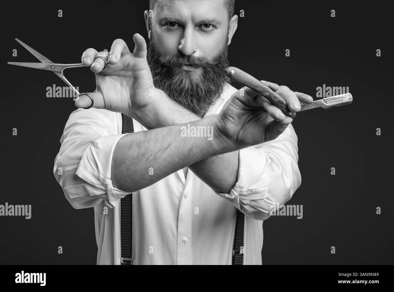 Barber man. Man barber with razor blade do haircut. Man barber making a ...