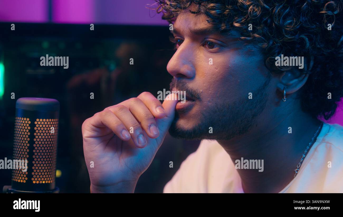 Pensive Arabian Indian Latina man thoughtful male guy gamer streamer ...