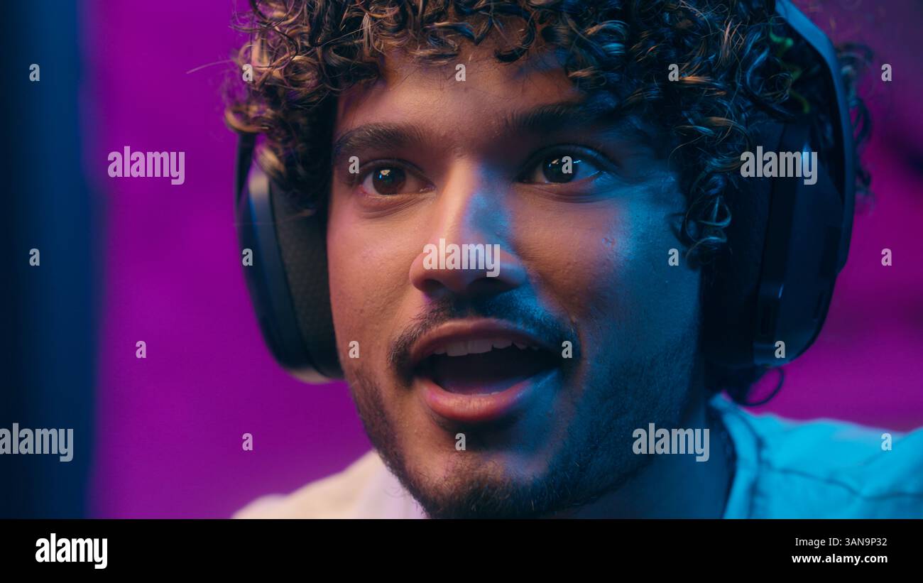 Close up hands keyboard Indian Arabian man player gamer face computer ...