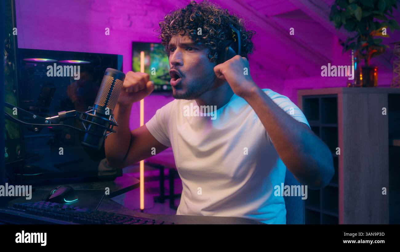 Emotional Arabian Latino man computer gamer cyber sport gaming streamer ...
