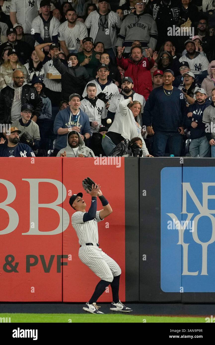 New York Yankees outfielder Aaron Judge makes a catch during the third ...