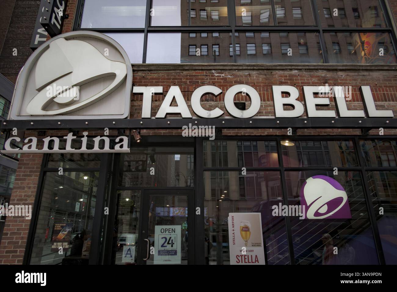 Sign at the entrance to a Taco Bell store in Manhattan. (Photo by Erik ...