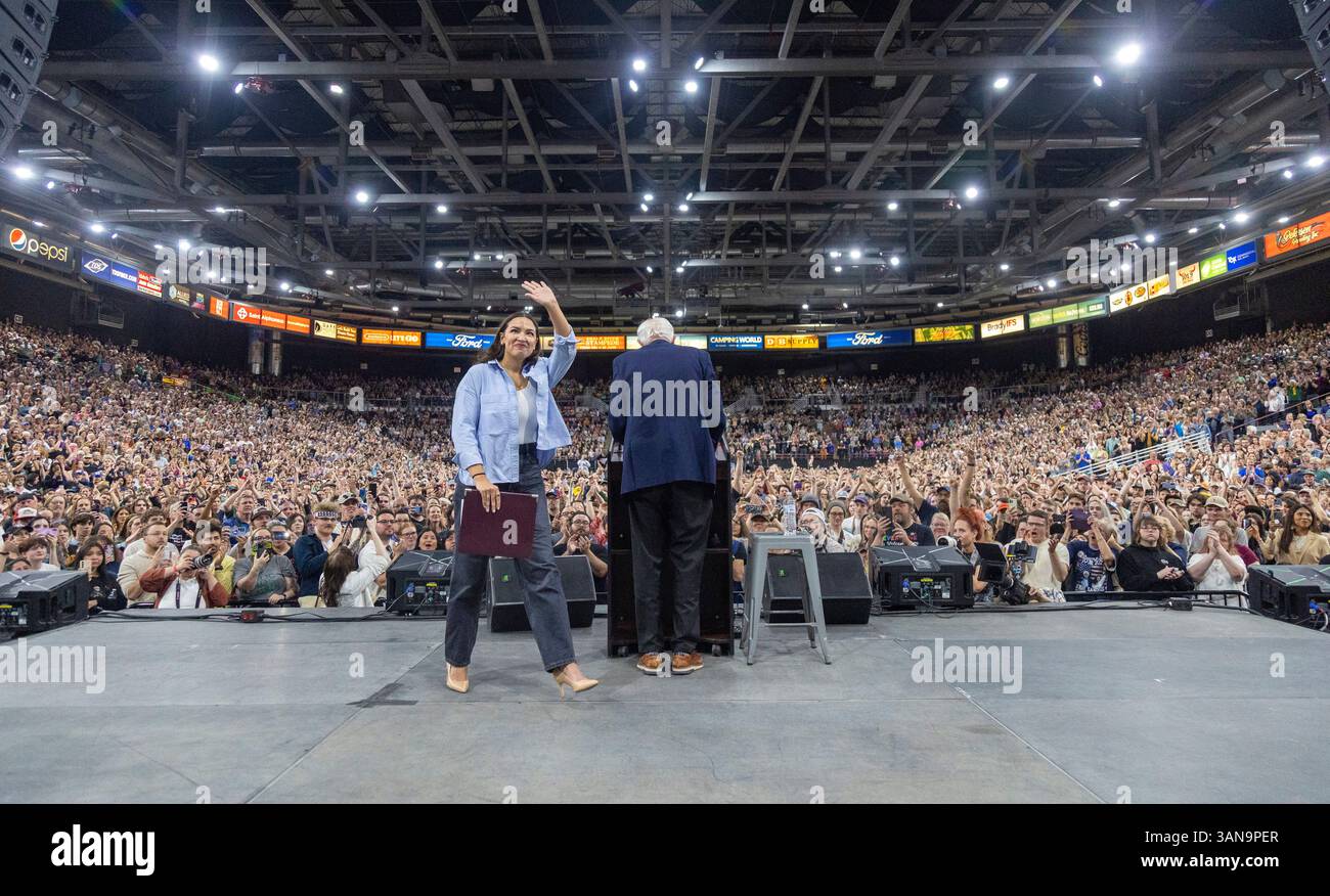 Rep. Alexandra Ocasio-Cortez, D-N.Y., waves while onstage with Sen ...