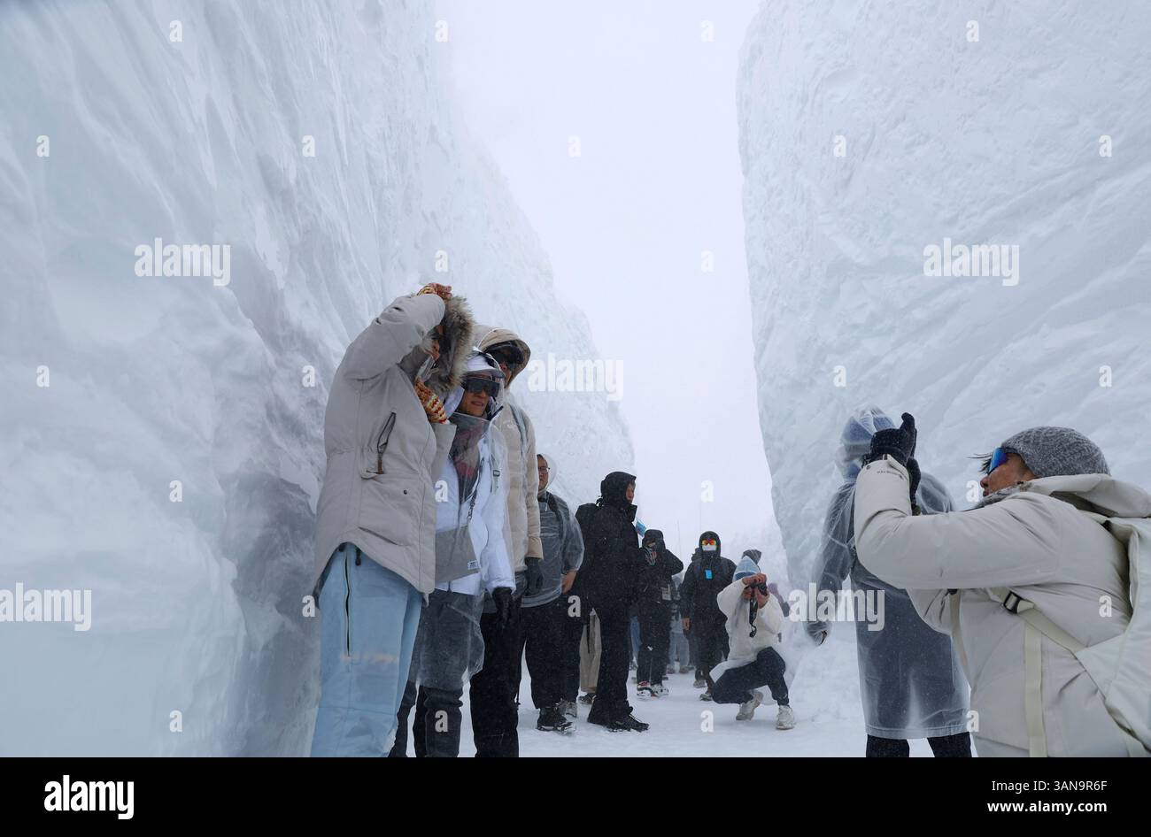 Lots of tourists enjoy walking and viewing the "Snow Corridor" at the ...