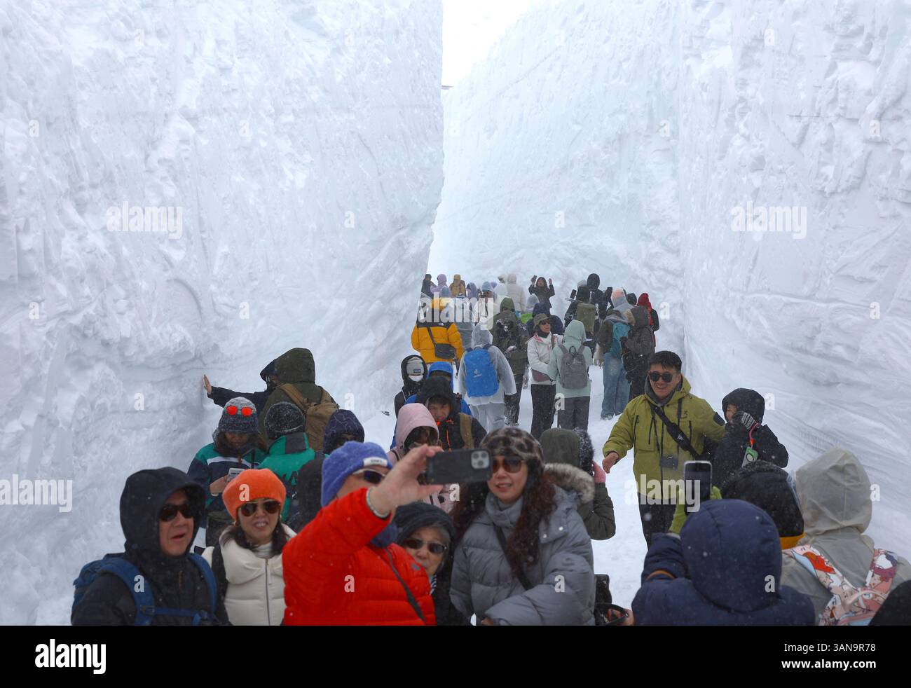 Lots of tourists enjoy walking and viewing the "Snow Corridor" at the ...