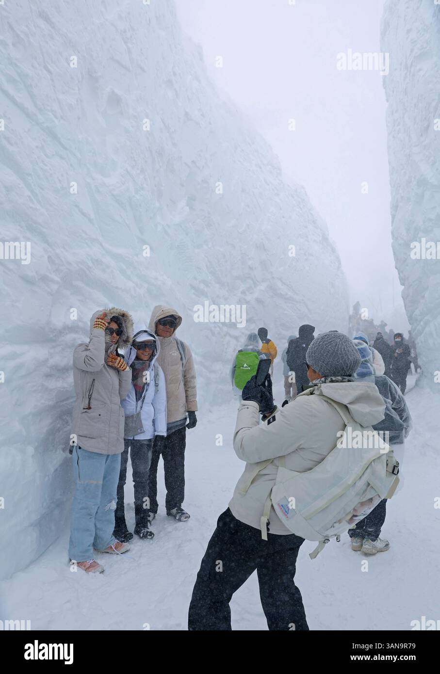 Lots of tourists enjoy walking and viewing the "Snow Corridor" at the ...