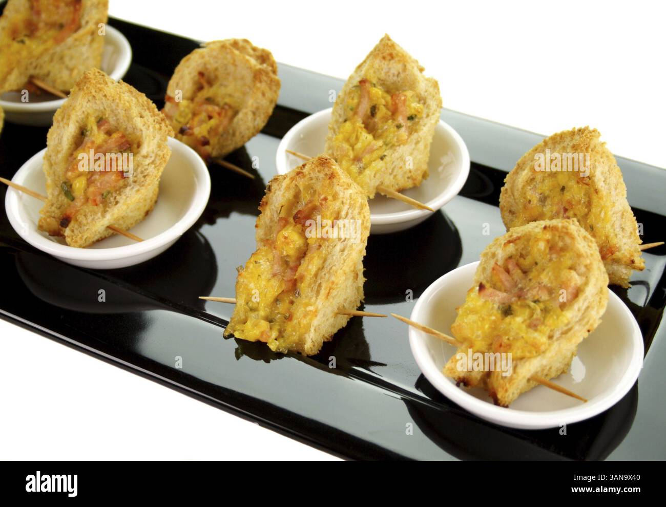 Baked triangles made with corn, ham and cheese with wholemeal bread ...