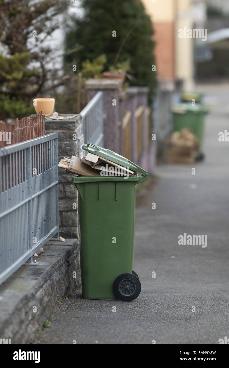 Paper waste bin for emptying on pavement, Stuttgart, Baden-Wuerttemberg ...