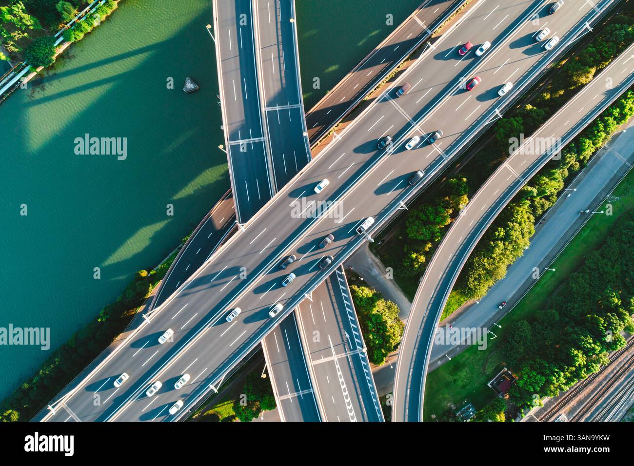 Aerial of vehicles navigate a complex highway system, showcasing ...