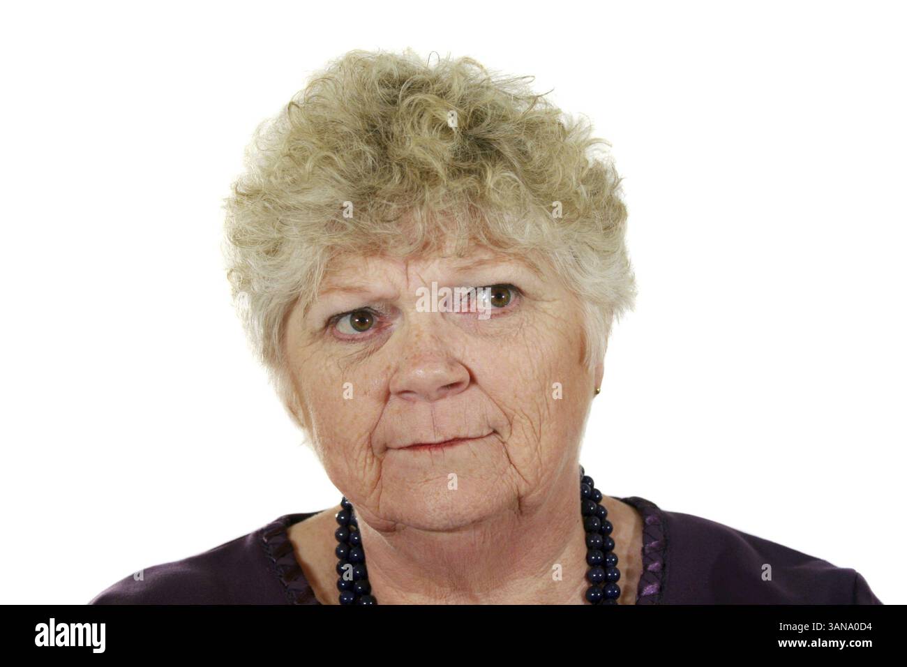 Senior lady with a serious and questioning look Stock Photo - Alamy