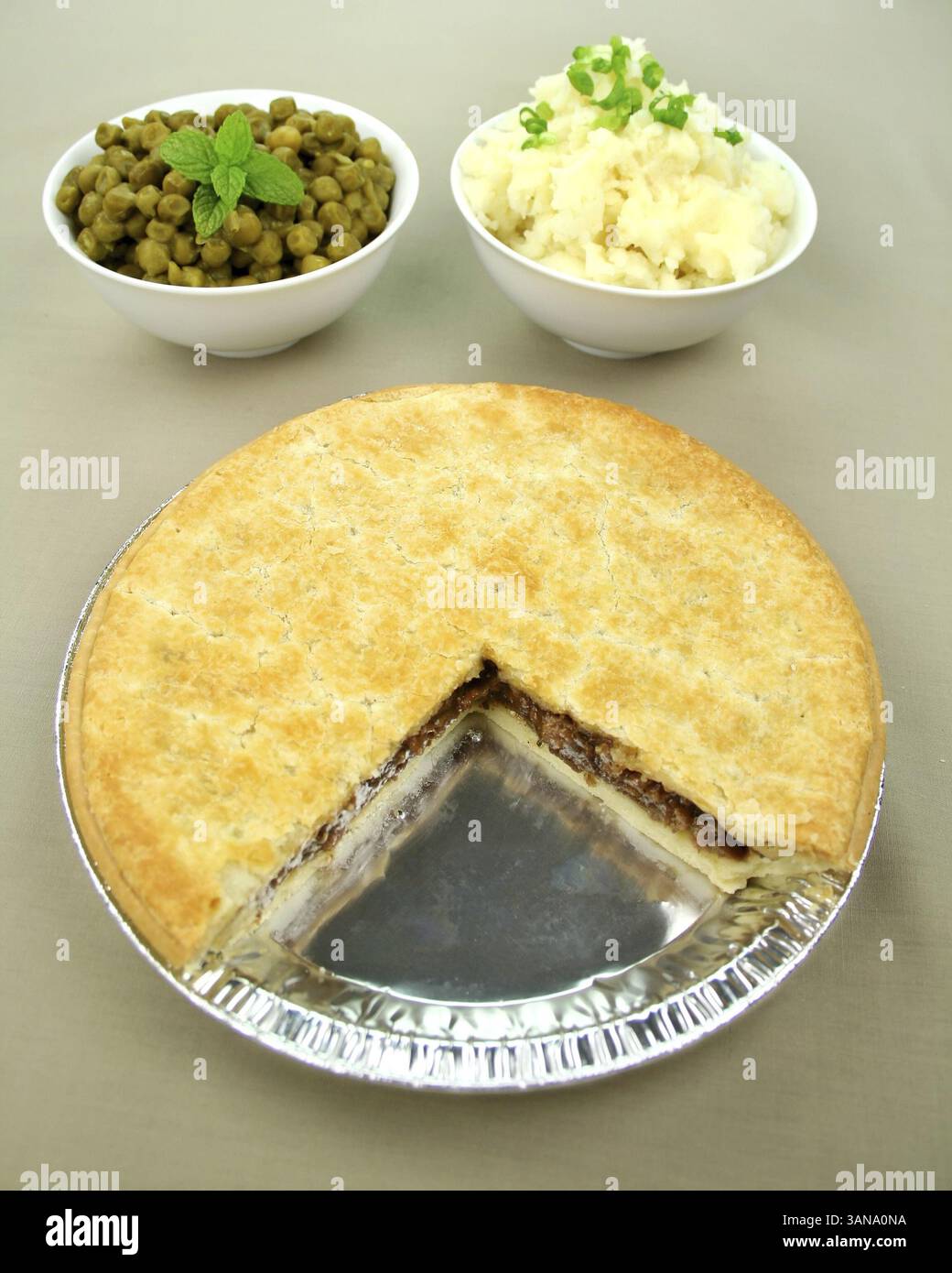 Family beef pie with peas and mashed potato ready to serve Stock Photo ...