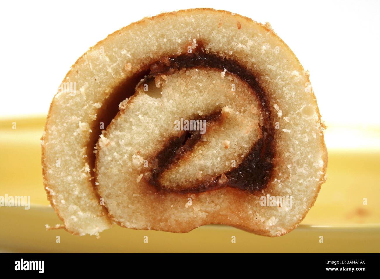 Sliced strawberry jam roll ready to serve Stock Photo - Alamy
