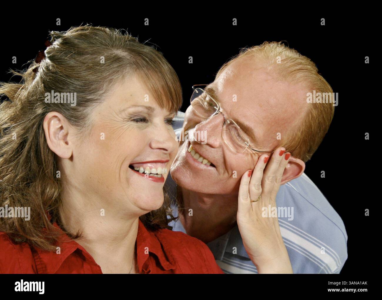 Middle aged couple playing around having fun Stock Photo - Alamy