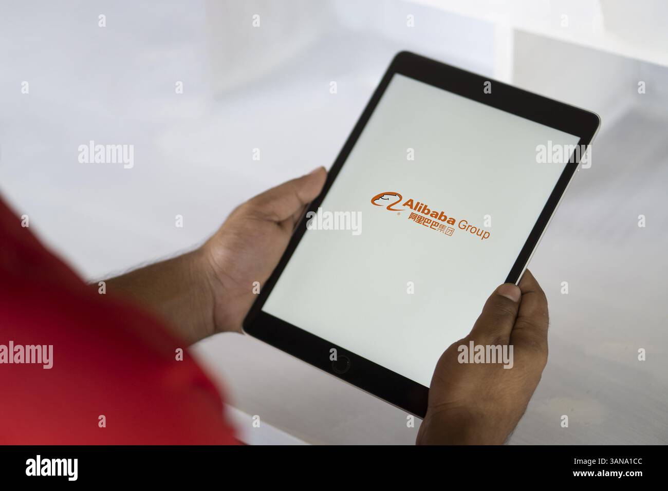 Dhaka, Bangladesh 23 March 2025: Alibaba logo on the screen smartphone ...