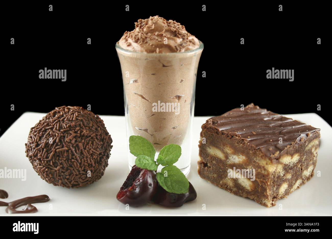 Triple chocolate treat of a rum ball and chocolate mousse and slice ...