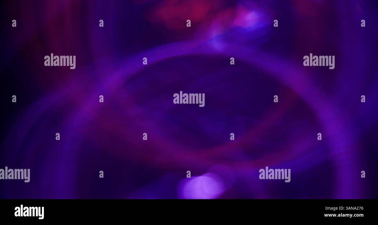 Gleaming glare. Defocused lens flare. Attractive purple neon color ...